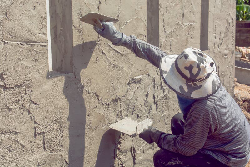 Construction Workers Plastering Building Wall Using Cement Plaster ...