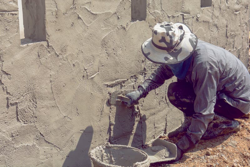 Construction Workers Plastering Building Wall Using Cement Plaster ...