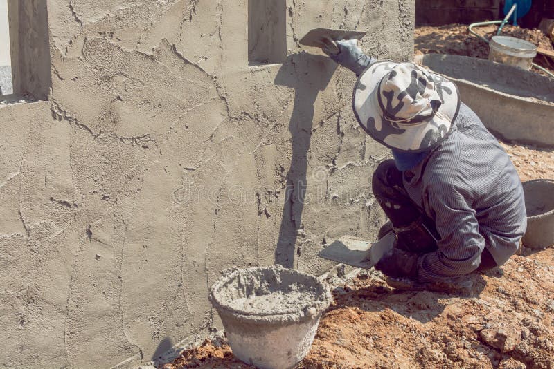 Construction Workers Plastering Building Wall Using Cement Plaster ...