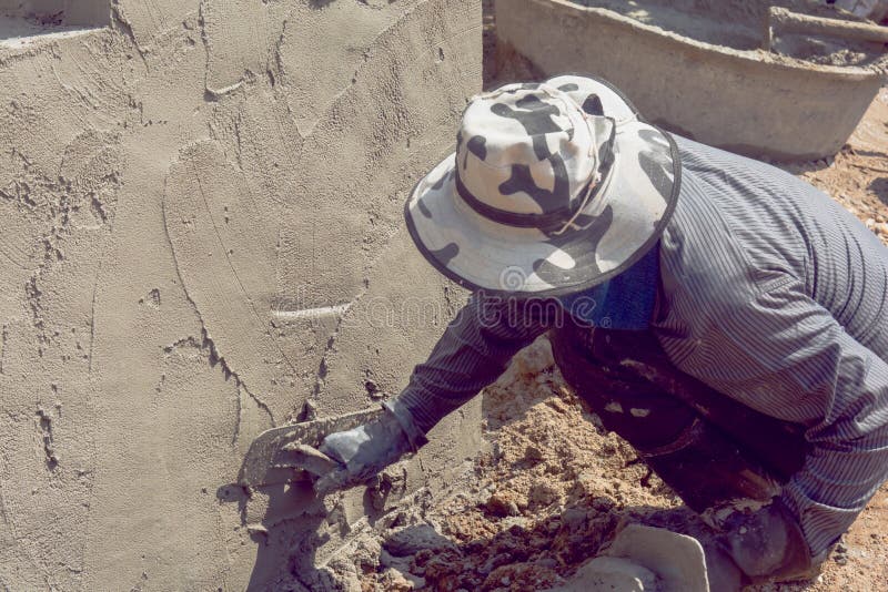 Construction Workers Plastering Building Wall Using Cement Plaster ...
