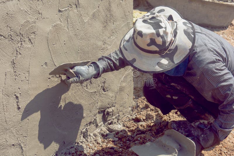 Construction Workers Plastering Building Wall Using Cement Plaster ...