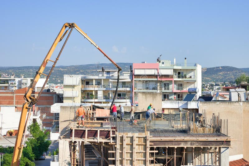 Construction Workers Pour Fresh Wet Cement Onto the Floor of the ...
