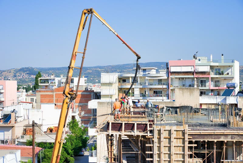 Construction Workers Pour Fresh Wet Cement Onto the Floor of the ...