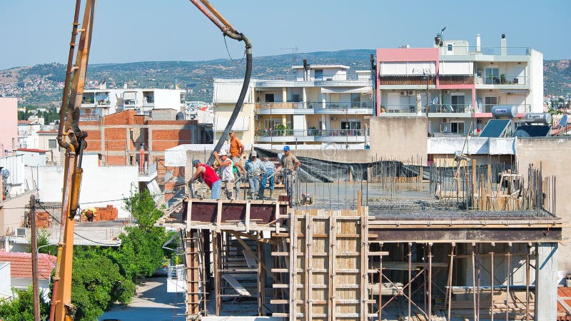 Construction Workers Pour Fresh Wet Cement Onto the Floor of the ...