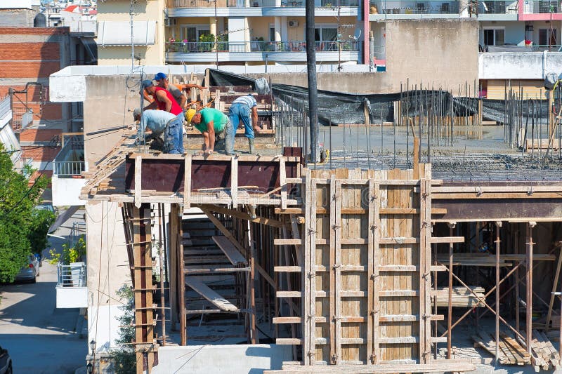 Construction Workers Pour Fresh Wet Cement Onto the Floor of the ...