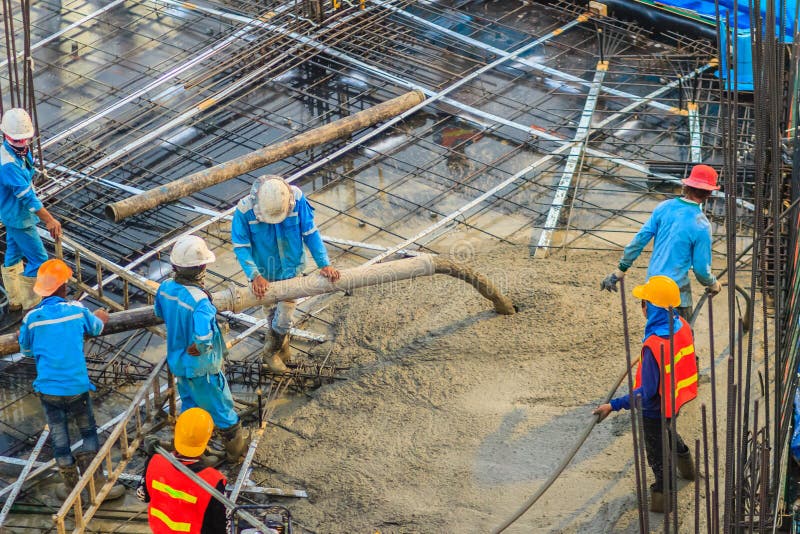 Construction Workers are Pouring Concrete in Post-tension Flooring Work ...