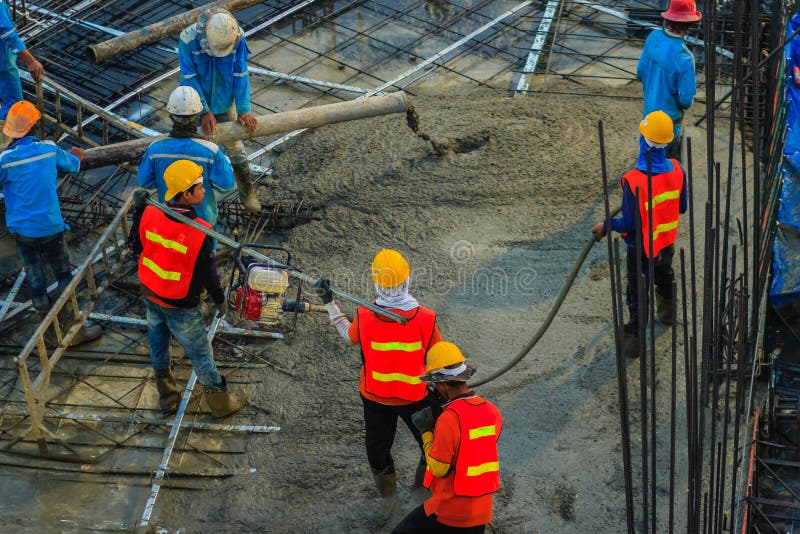 Construction Workers are Pouring Concrete in Post-tension Flooring Work ...