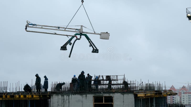 Construction Workers Pouring Wet Concrete Using Concrete Spider Hose or ...