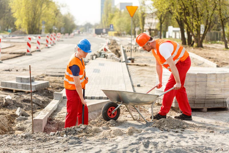 Construction Workers Repairing Road Stock Image - Image of renovation ...