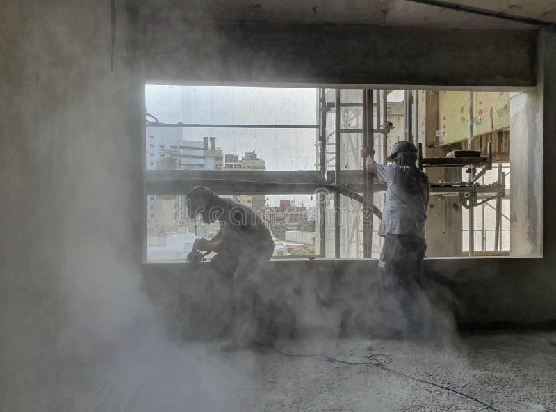 Construction Workers Sanding a Window that Produces Dust Stock Image ...