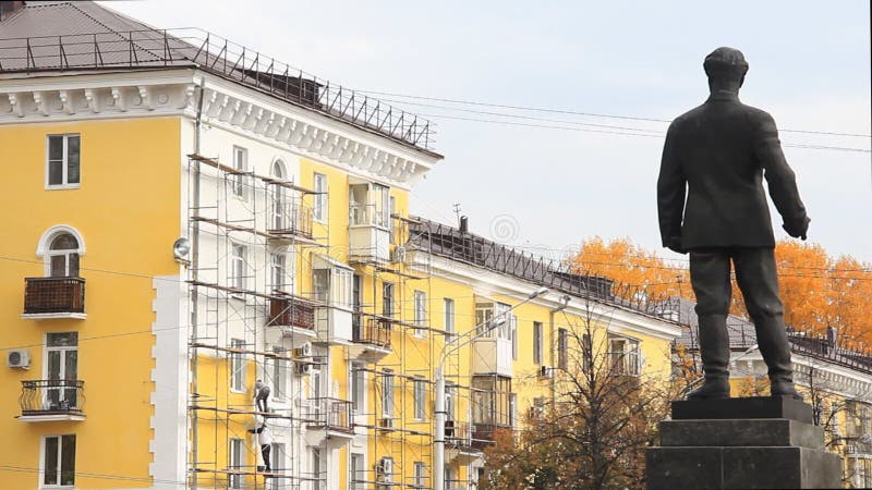 Construction Workers on Scaffolding Repairing the Building. Metal ...