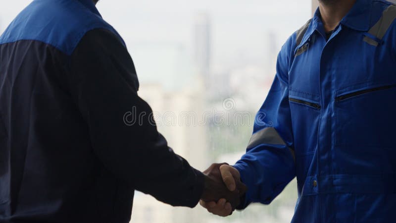 Handshake between Engineer Foreman Manager and Electrician Stock Image ...