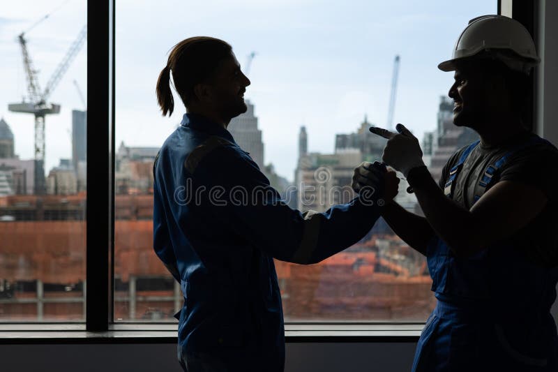Handshake between Engineer Foreman Manager and Electrician Stock Image ...