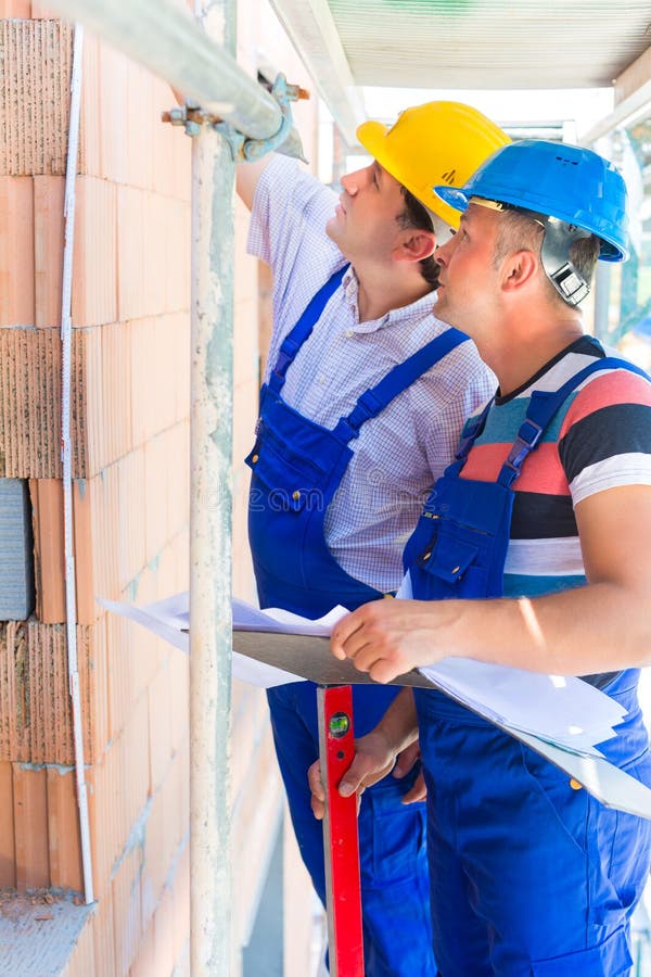 Female Construction Worker on Site Laying Slate Tiles Stock Photo ...