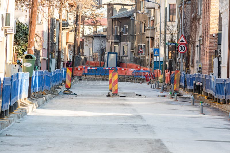 Construction Workers at Construction Site and Heavy Duty Bulldozer in ...