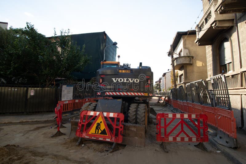 Construction Workers at Construction Site and Heavy Duty Bulldozer in ...