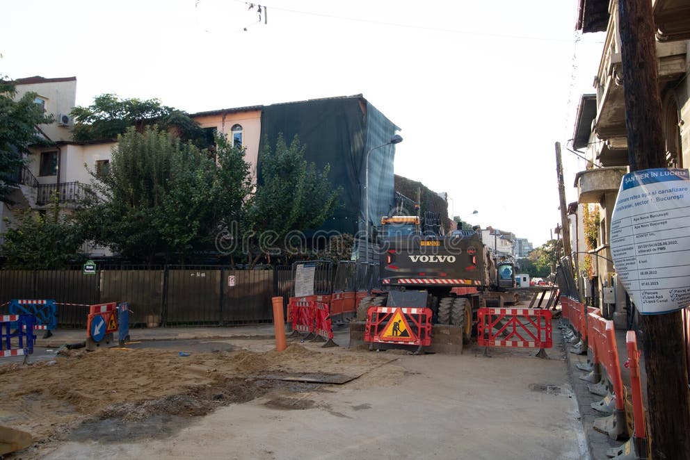 Construction Workers at Construction Site and Heavy Duty Bulldozer in ...