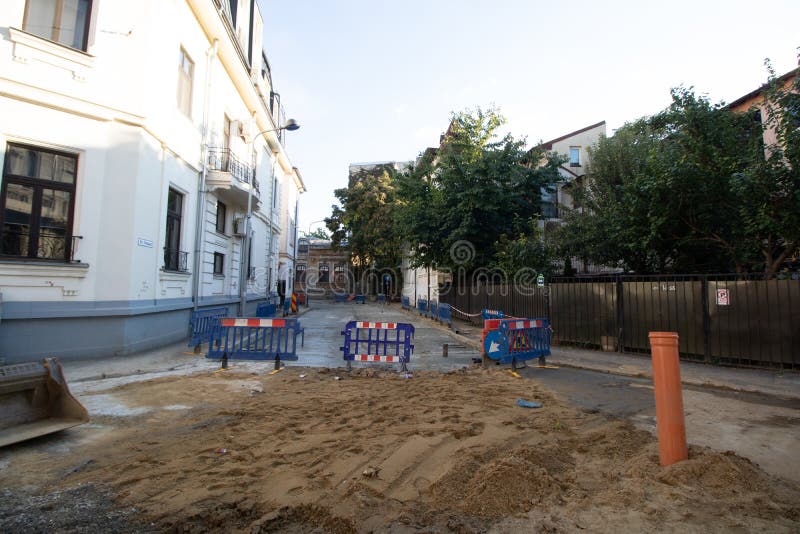 Construction Workers at Construction Site and Heavy Duty Bulldozer in ...