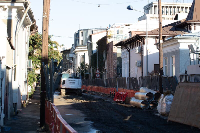 Construction Workers at Construction Site and Heavy Duty Bulldozer in ...