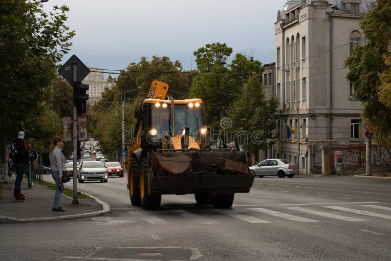 Construction Workers at Construction Site and Heavy Duty Bulldozer in ...