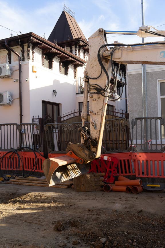 Construction Workers at Construction Site and Heavy Duty Bulldozer in Bucharest, Romania, 2023 ...