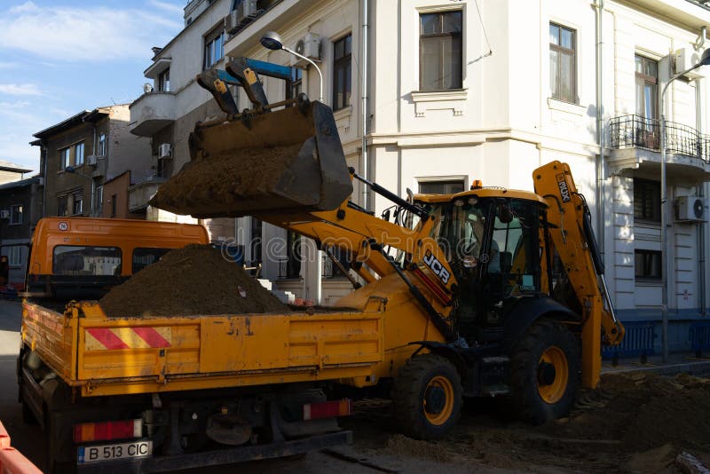 Construction Workers at Construction Site and Heavy Duty Bulldozer in ...