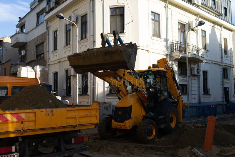 Construction Workers at Construction Site and Heavy Duty Bulldozer in ...