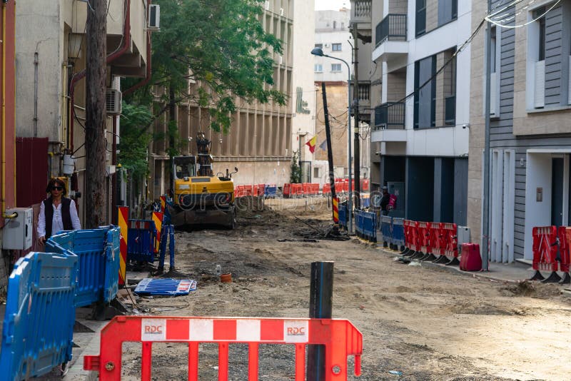 Construction Workers at Construction Site and Heavy Duty Bulldozer in ...