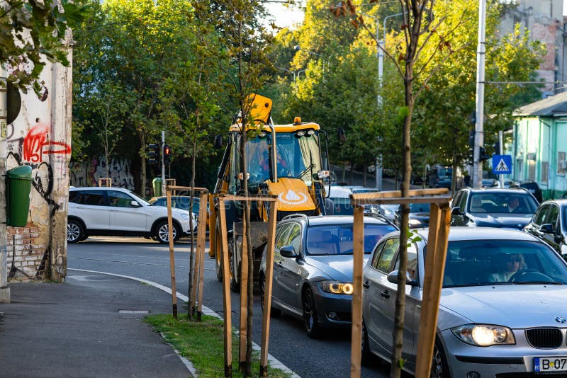 Construction Workers at Construction Site and Heavy Duty Bulldozer in ...