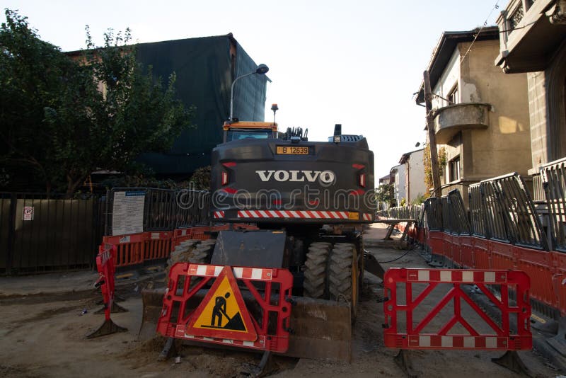 Construction Workers at Construction Site and Heavy Duty Bulldozer in ...