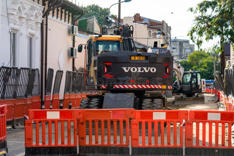 Construction Workers at Construction Site and Heavy Duty Bulldozer in ...