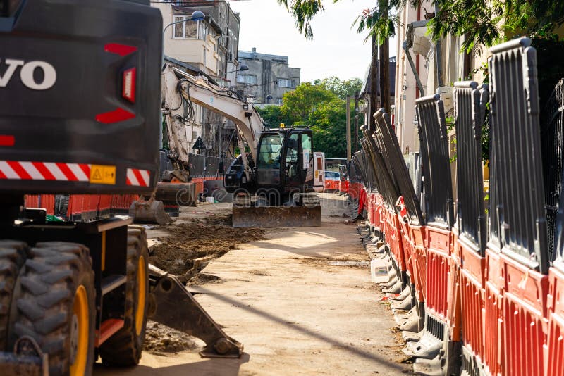 Construction Workers at Construction Site and Heavy Duty Bulldozer in ...