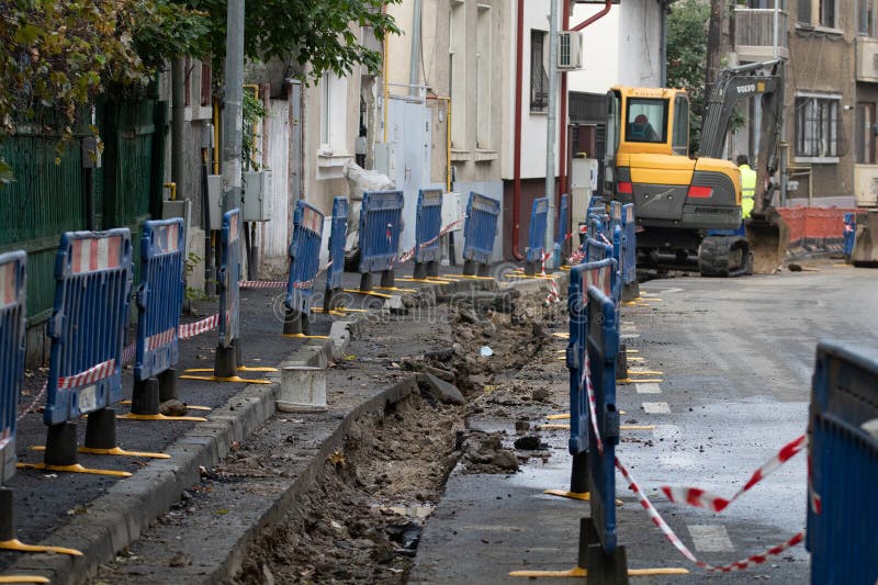 Construction Workers at Construction Site and Heavy Duty Bulldozer in ...