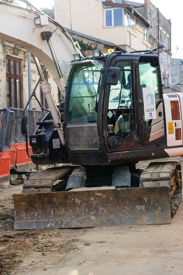 Construction Workers at Construction Site and Heavy Duty Bulldozer in ...