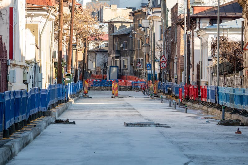 Construction Workers at Construction Site and Heavy Duty Bulldozer in ...