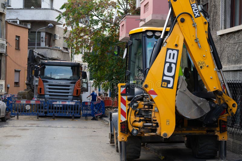 Construction Workers at Construction Site and Heavy Duty Bulldozer in ...