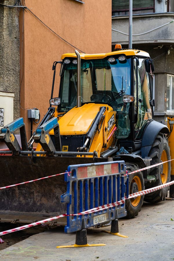 Construction Workers at Construction Site and Heavy Duty Bulldozer in ...