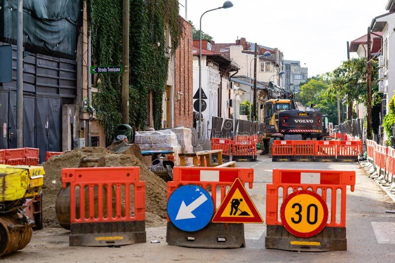 Construction Workers at Construction Site and Heavy Duty Bulldozer in ...