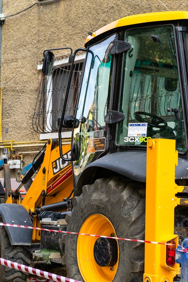 Construction Workers at Construction Site and Heavy Duty Bulldozer in ...