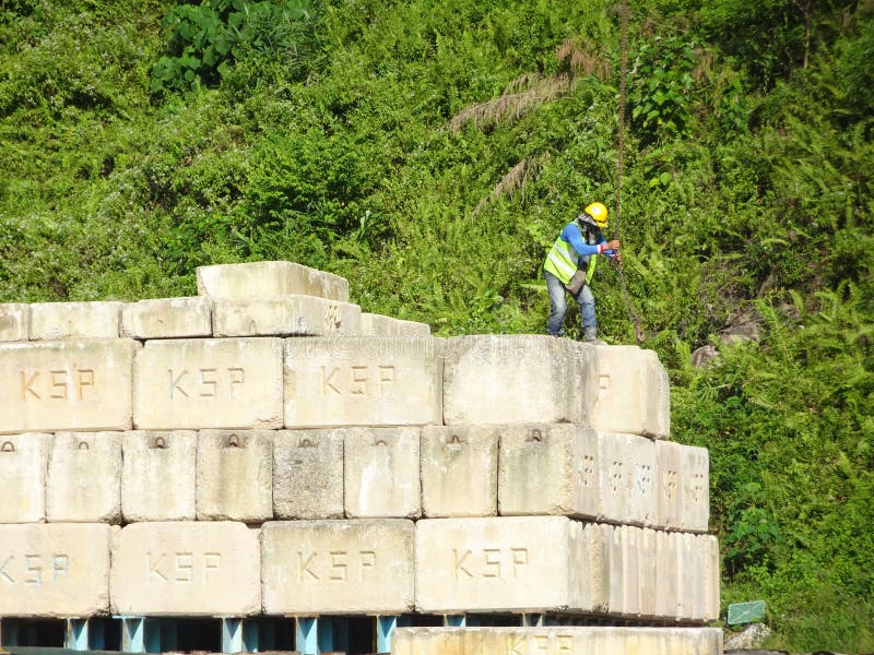 Construction Workers Stacking the Maintain Load Test Block Also Known ...