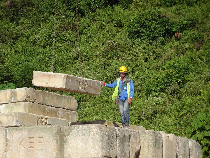 Construction Workers Stacking the Maintain Load Test Block Also Known ...