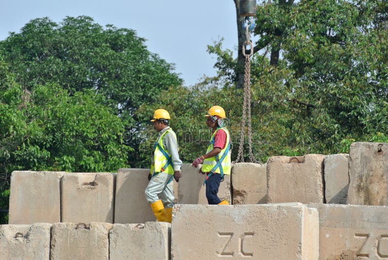 Construction Workers Stacking the Maintain Load Test Block at the ...