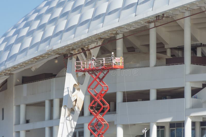 Construction Workers Standing in the Scissors Lifting Crane Bucket ...