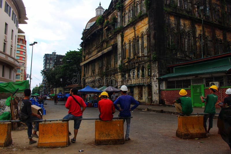 Construction Workers Take a Break Amid Colonial Buildings in Downtown ...