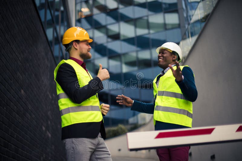 Construction Workers Talk at Job Site Stock Image - Image of business ...