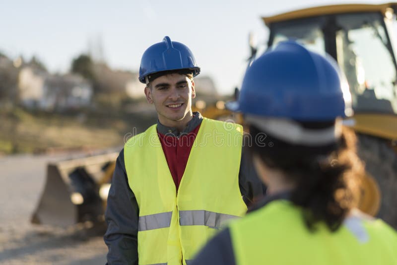 Construction Workers Talking Outdoors Stock Photo - Image of ...