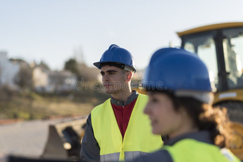 Construction Workers Talking Outdoors Near To Excavator Machine Stock ...