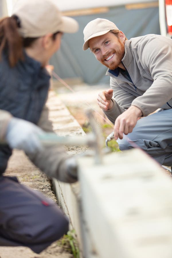 Construction Workers in Uniform Have Job on Building Stock Image ...