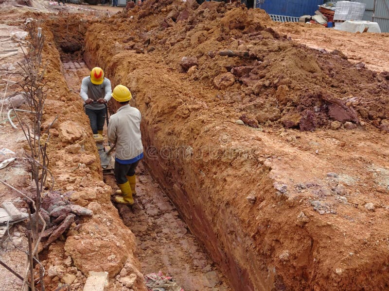 Construction Workers are Using the Baby Compactor To Level and Compact ...