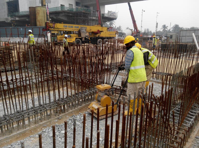 Construction Workers are Using the Baby Compactor To Level and Compact ...